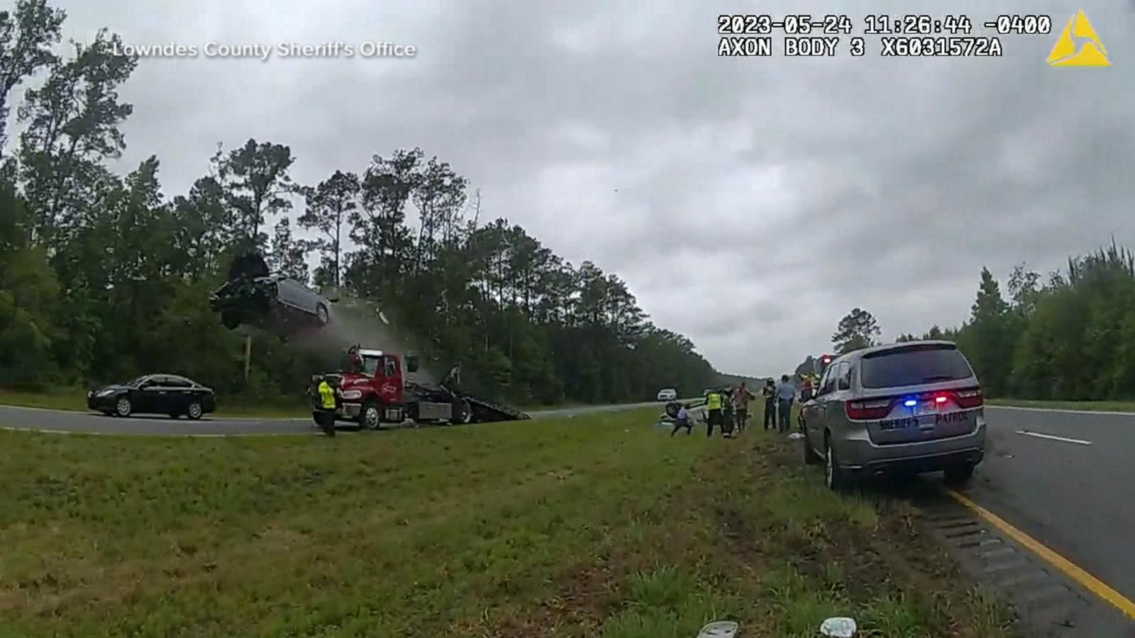 Police Cam Shows Moment Car Flips Over Tow Truck On Highway Good