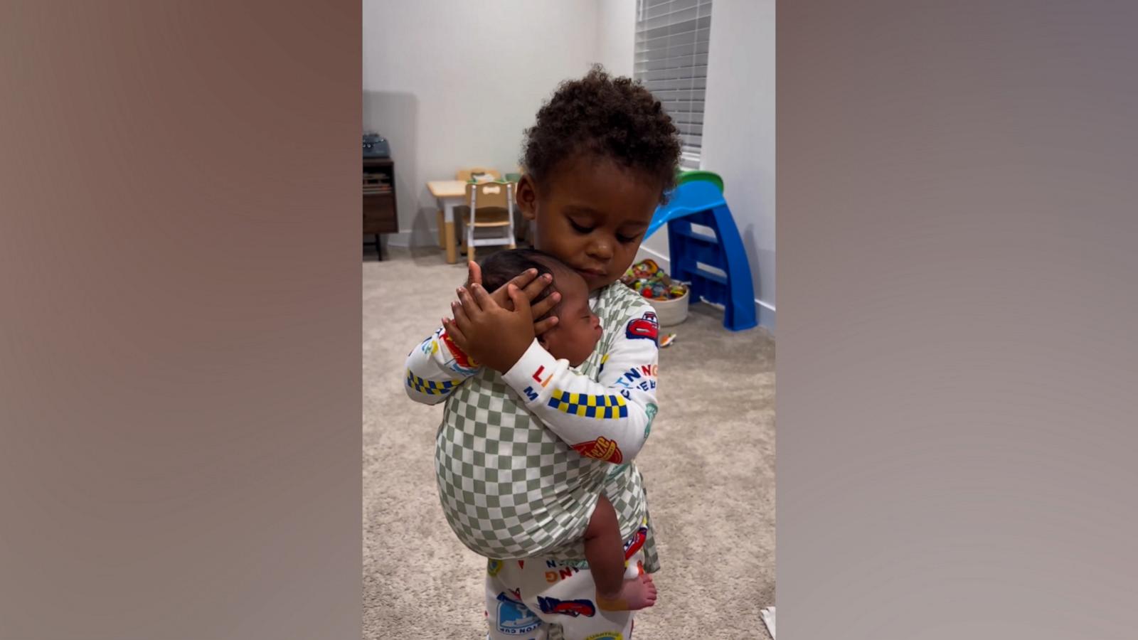 Big brother rocks baby sister in adorable video - Good Morning America