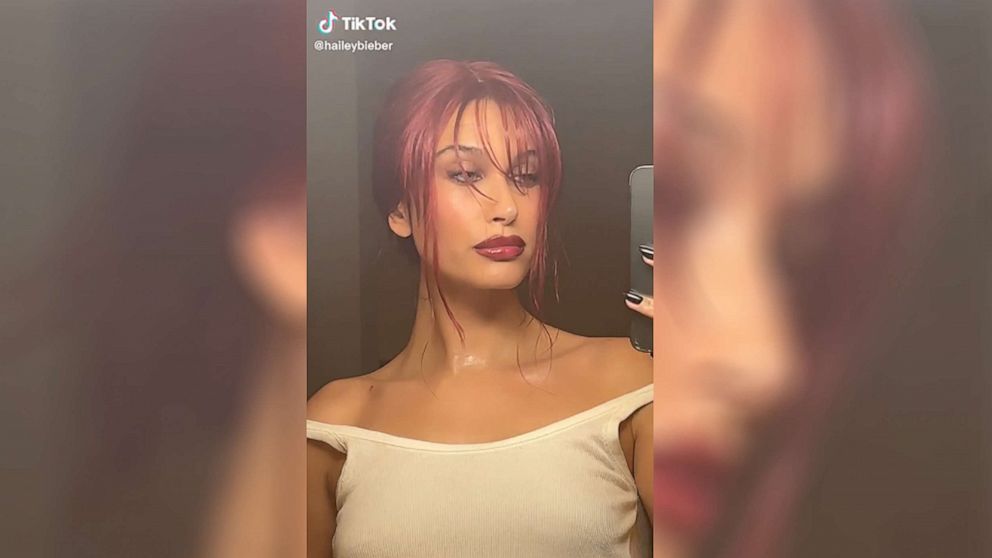 Hailey Bieber shows off ruby red hair for Halloween and fans approve ...