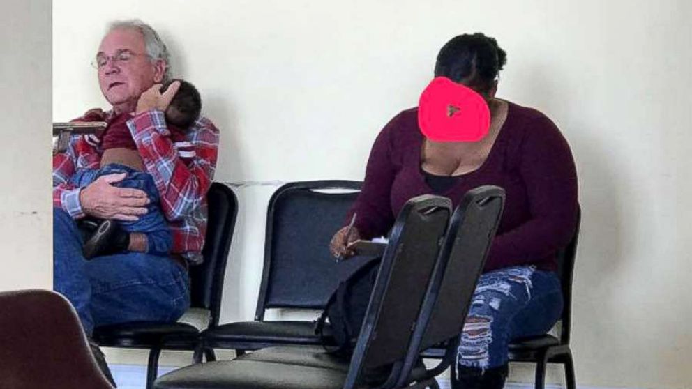 The story behind the viral photo of man cradling baby that's been ...