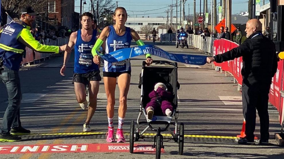 Mom sets likely world record for half-marathon while pushing a stroller ...