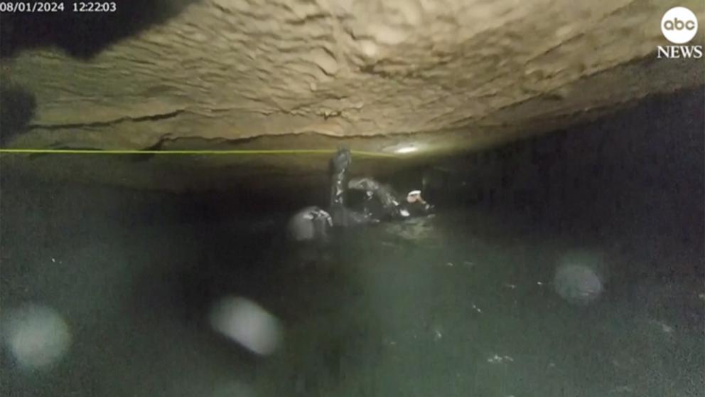 Five people rescued from flooded cave | GMA