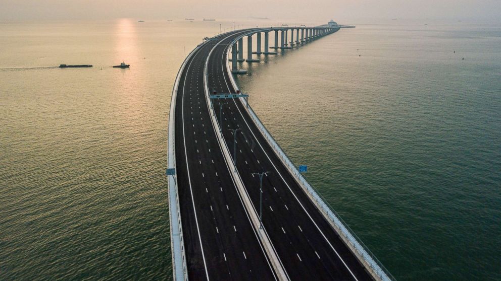 China opens world’s longest sea bridge and tunnel to connect Hong Kong ...