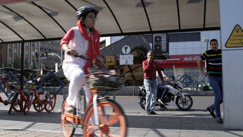 Bright orange bikes help women break barriers in Iran - ABC News