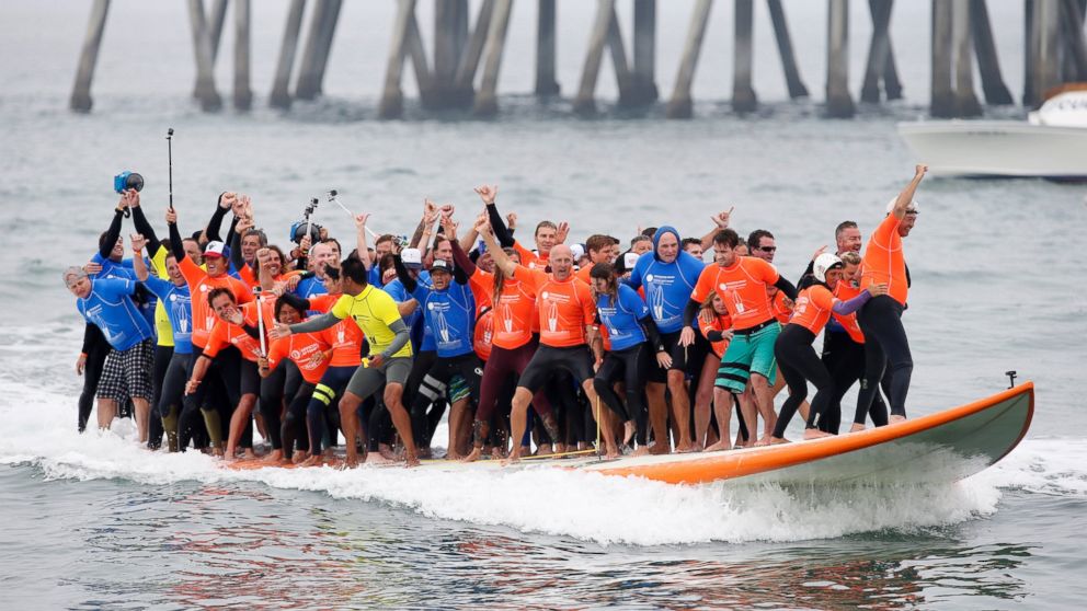 66 Surfers Set World Record by Riding on a Board at Once - ABC News