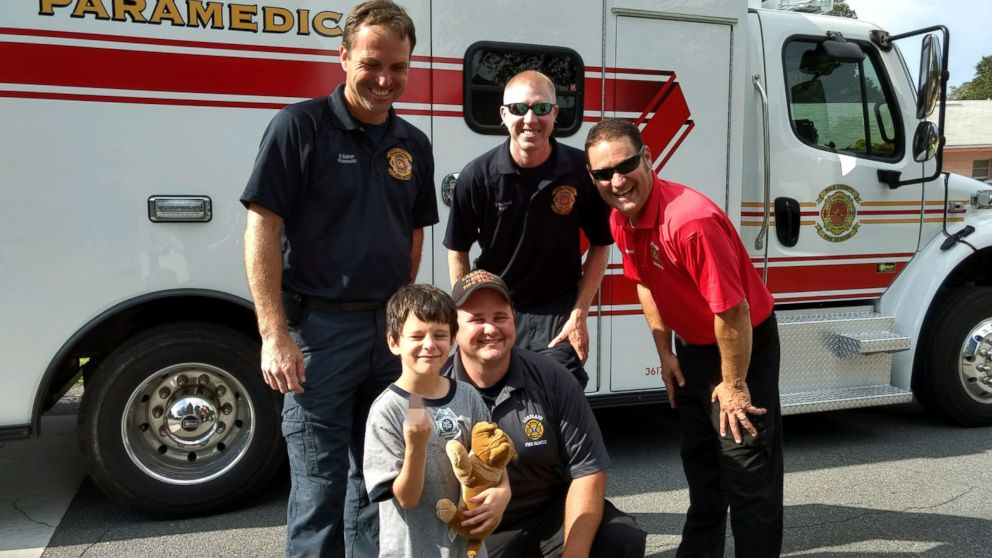 Firefighters snap hilarious photo after helping free boy's middle ...