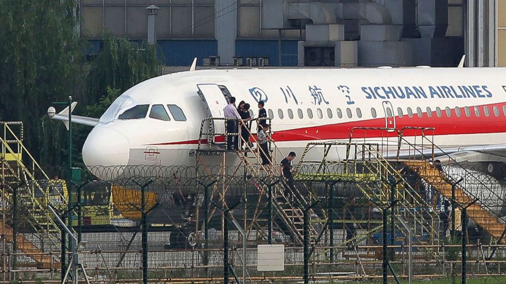 Co-pilot partially sucked out of broken cockpit window, escapes with ...