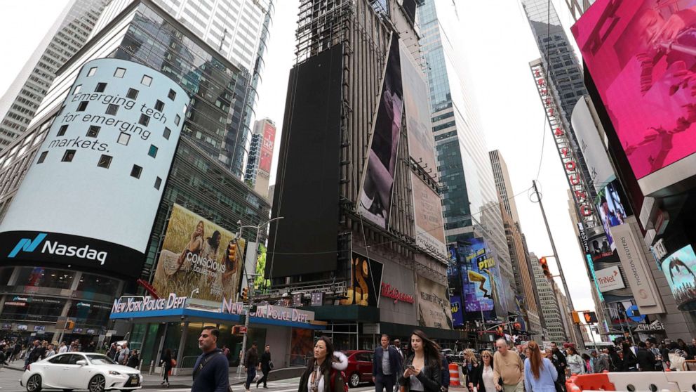 Panic erupts in Times Square when motorcycle backfiring causes false ...